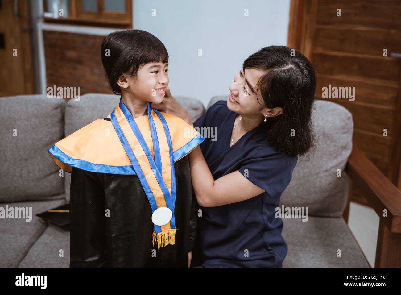 Kindergarten graduation. Asian family and parent on kinder graduate day ...