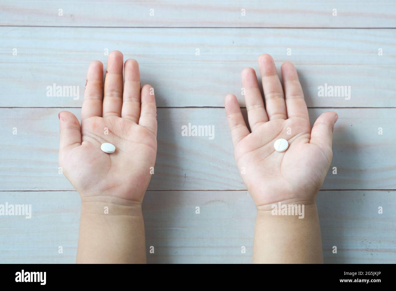 Child taking pills hi-res stock photography and images - Alamy