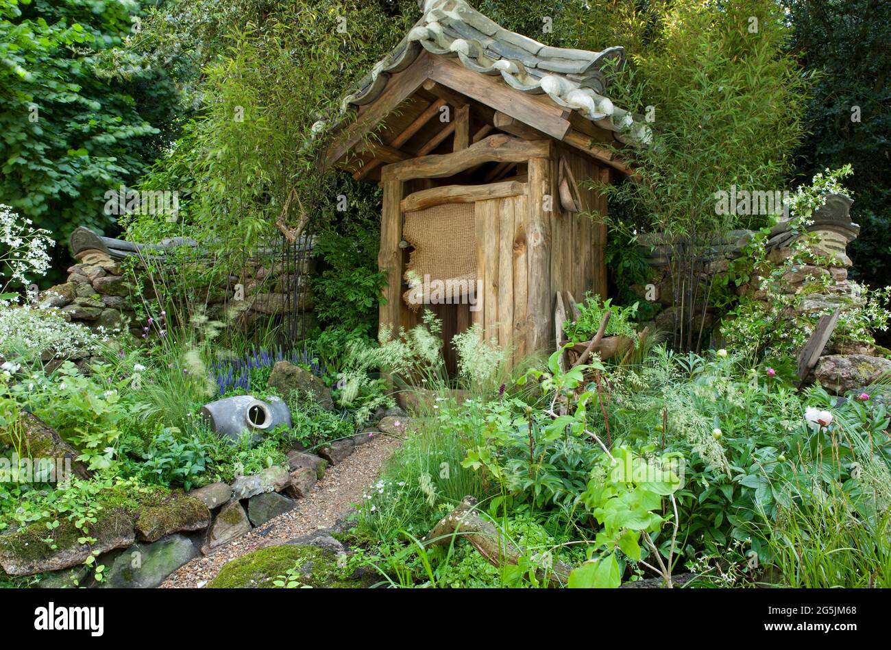 Wooden Oriental pavilion toilet, gravel path, drain pipe stone water ...