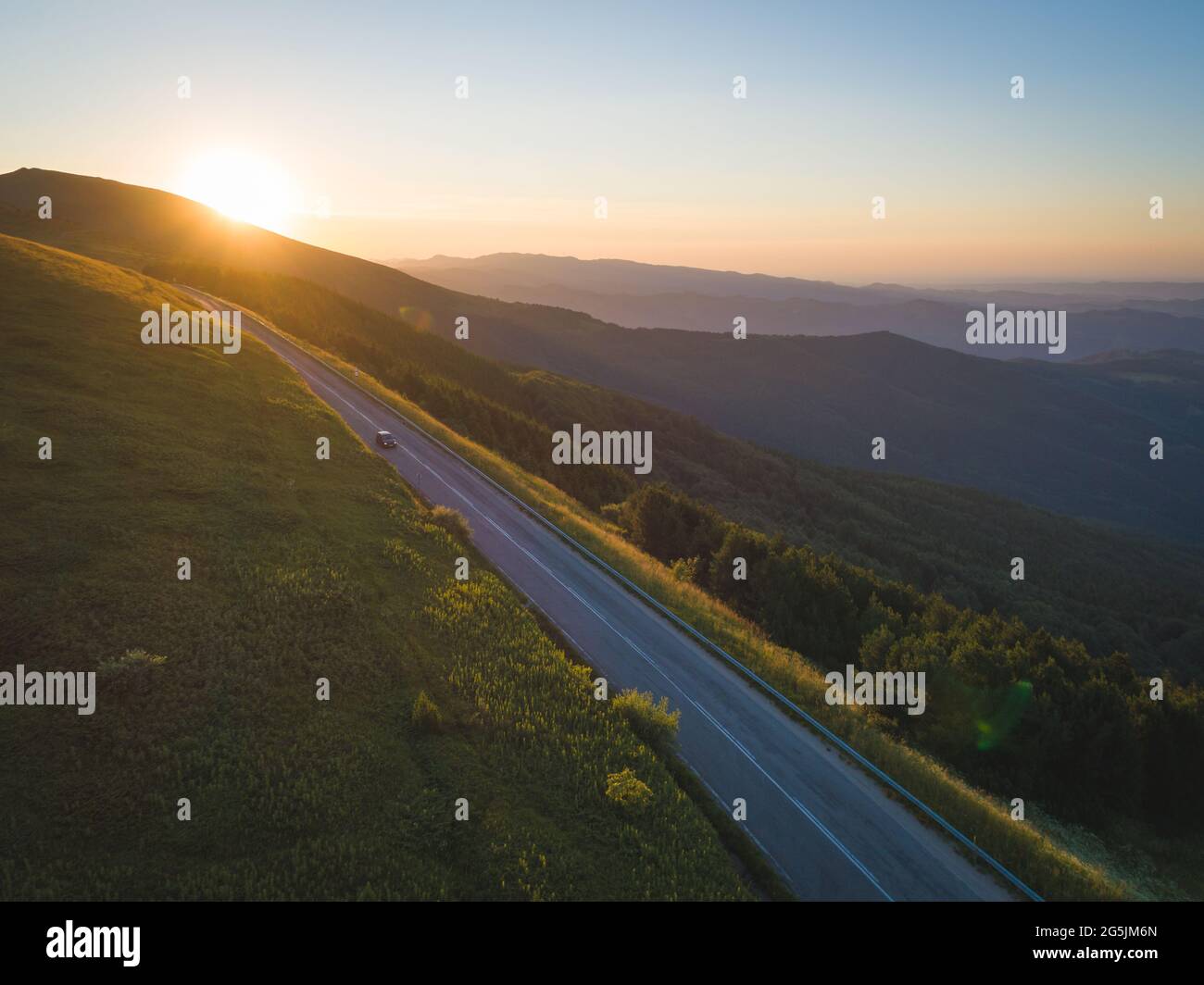 Sunset at mountain ,chasing car with drone Stock Photo - Alamy