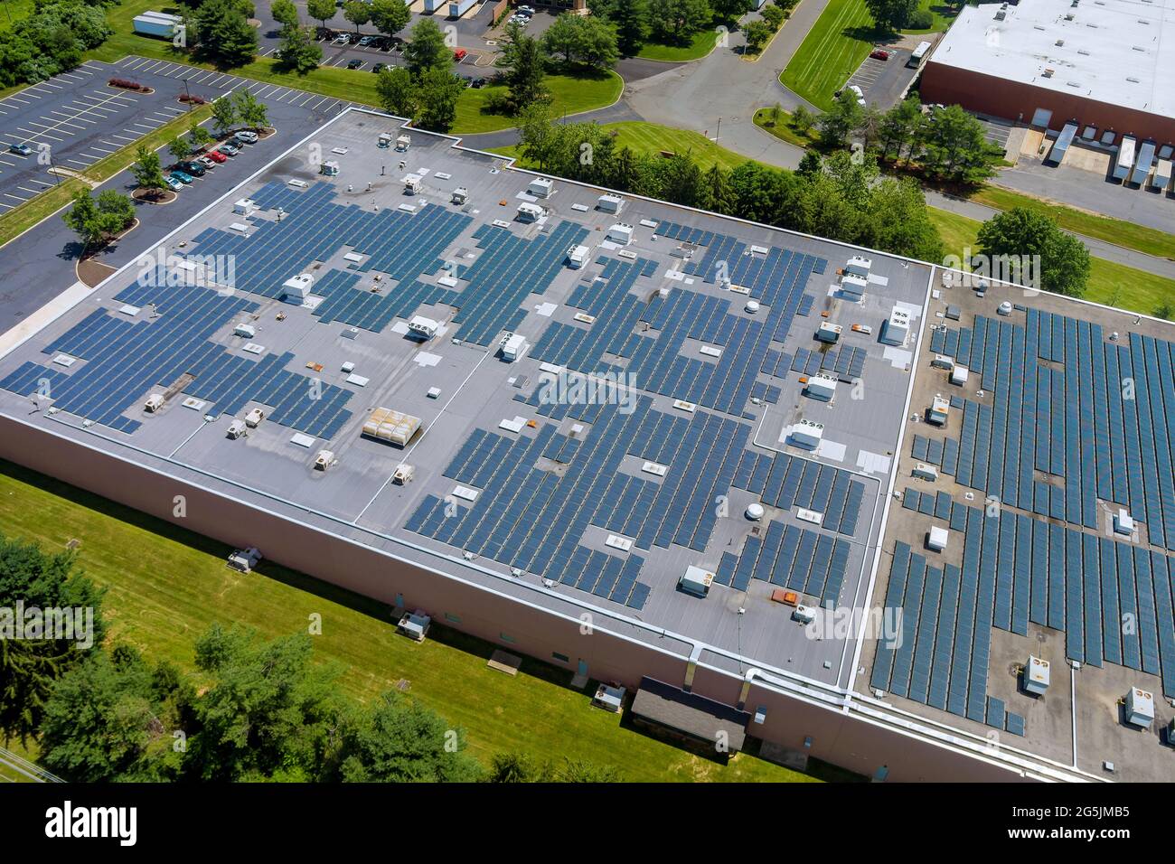 Panoramic aerial view solar panel energy on the an industrial warehouse ...