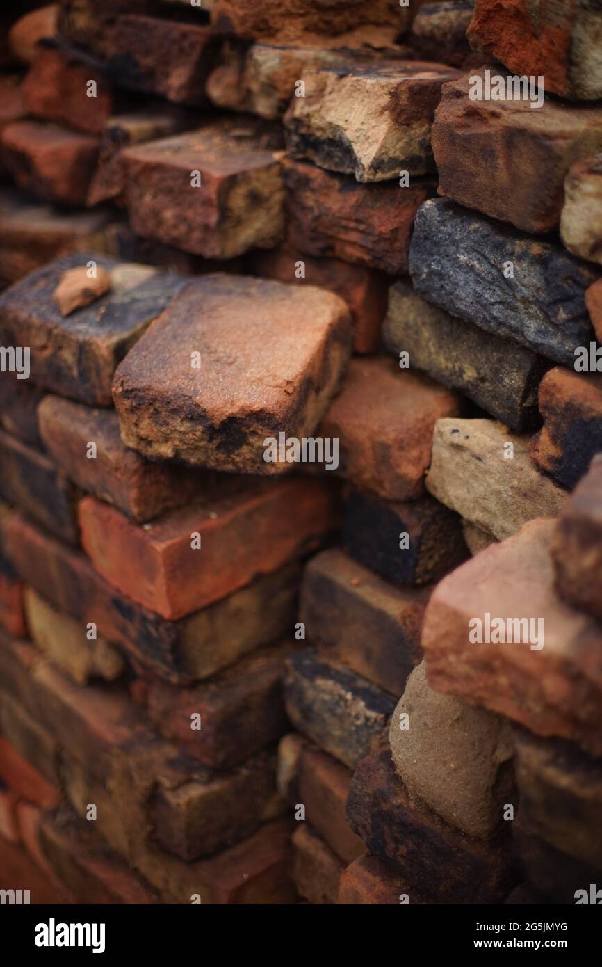 stack of antique earthen red-black bricks background Stock Photo - Alamy