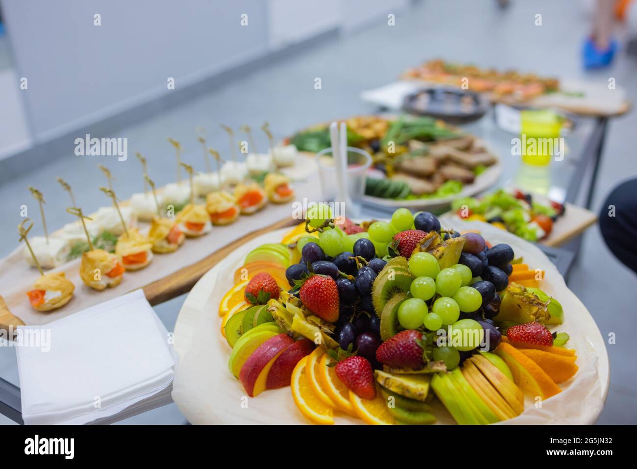 Dinner table with snacks decorated with beautiful summer flowers. Food ...