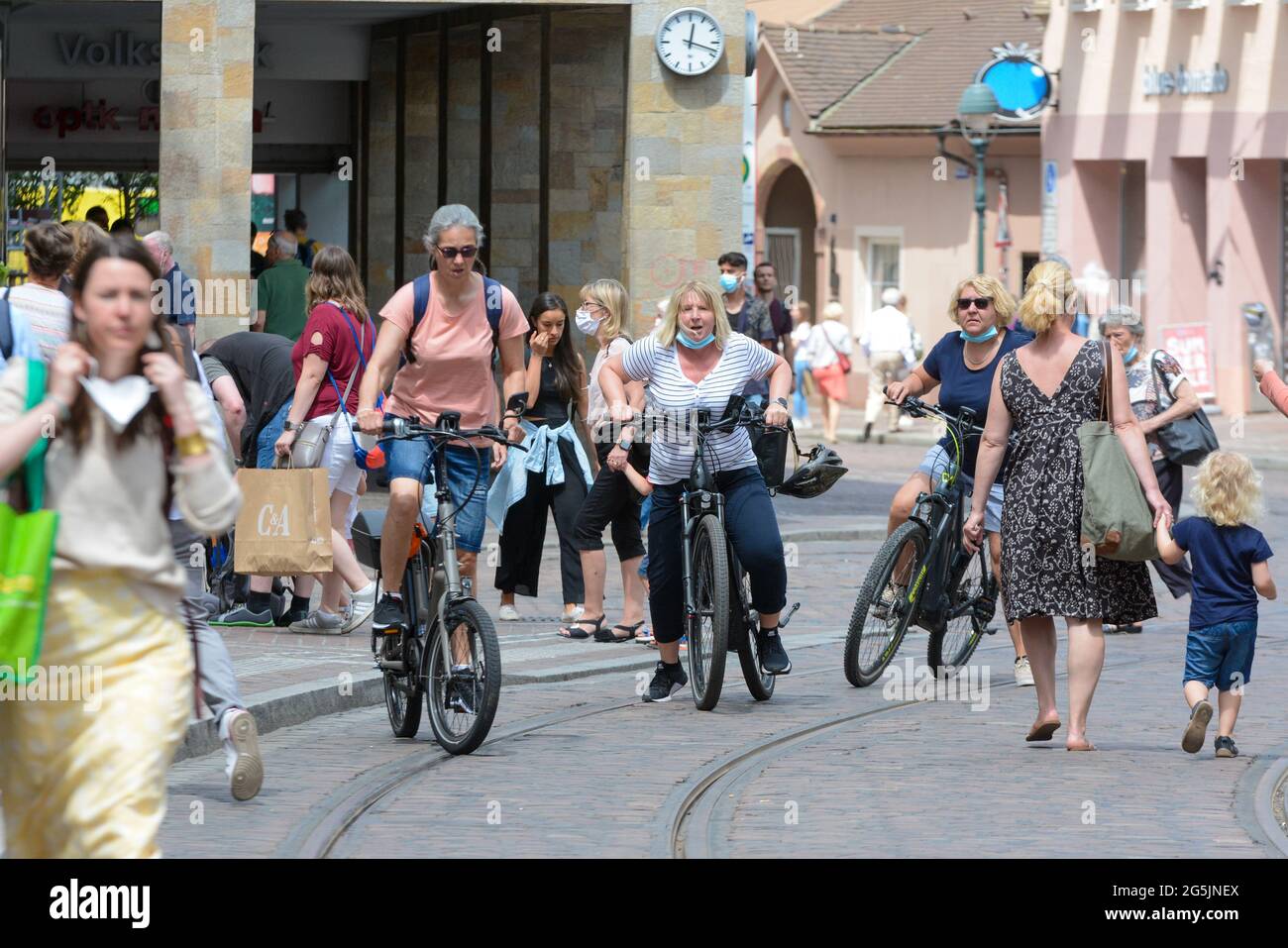 Freiburg im Breisgau, Germany, June 26, 2021: Pedestrians and cyclists ...