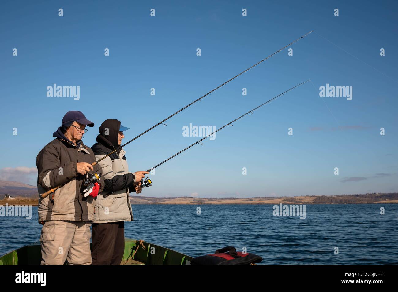 Two men fishing from a boat hi-res stock photography and images - Alamy