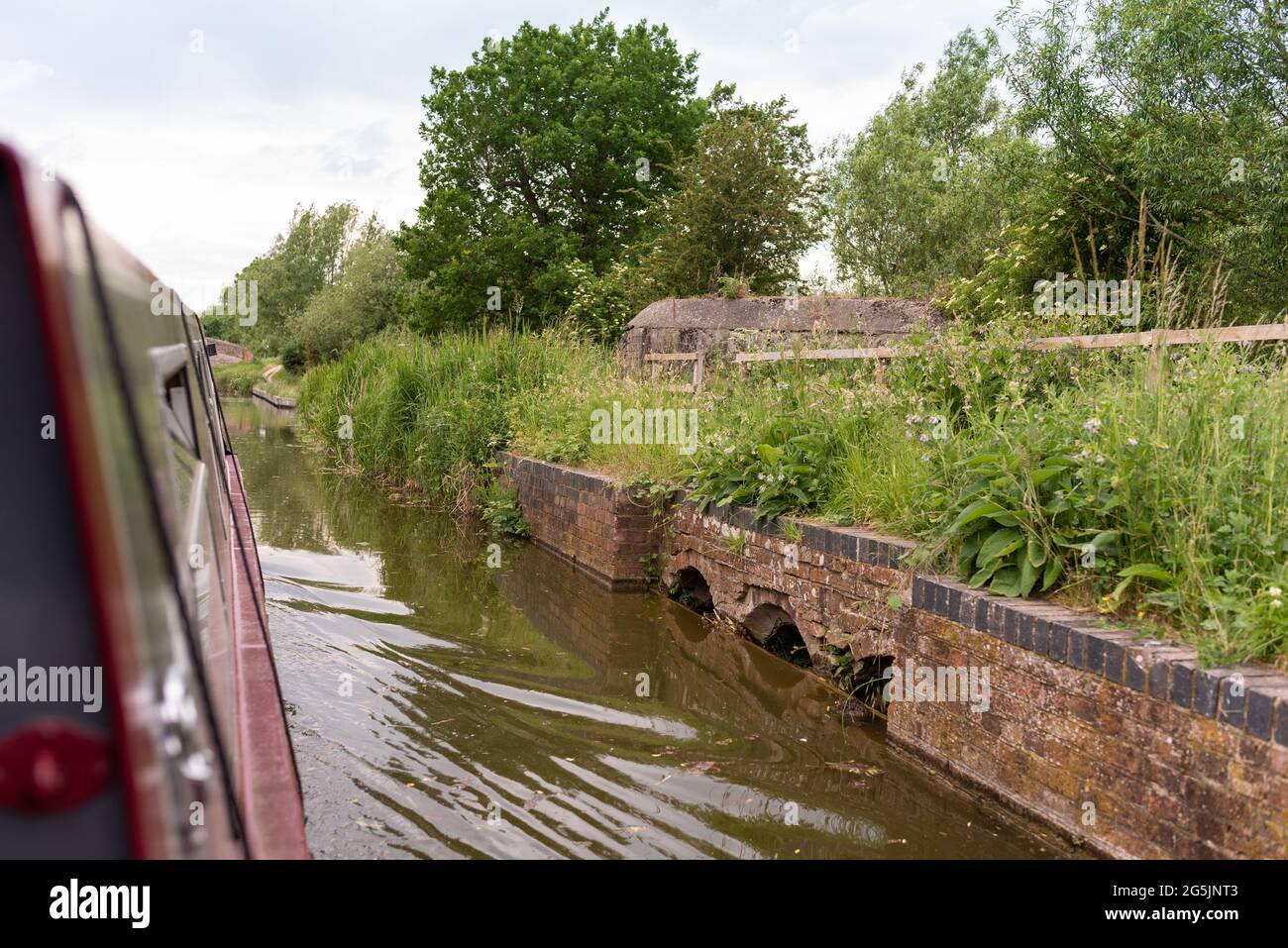 view from side of canal boat travelling down river Stock Photo - Alamy