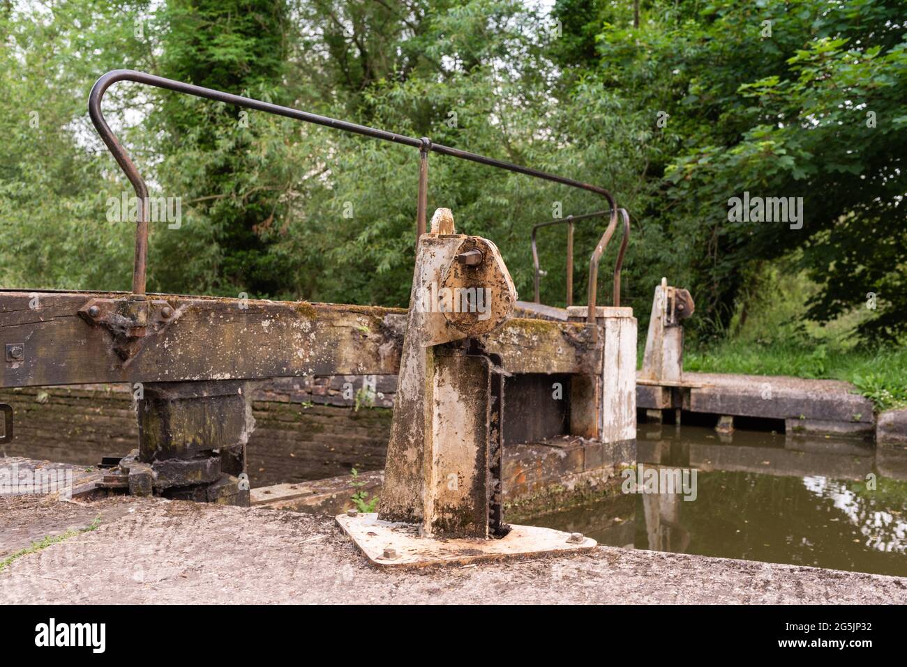 Lock gates holding back water on canal uk Stock Photo - Alamy