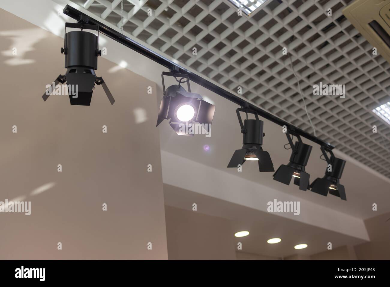Spotlights under the ceiling on the wall. Track LED-lighting system ...