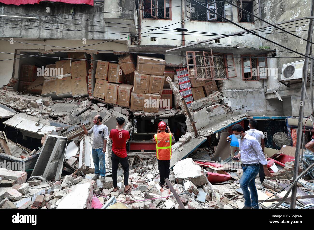 Dhaka, Bangladesh - June 28, 2021: Members of the rescue team work to ...