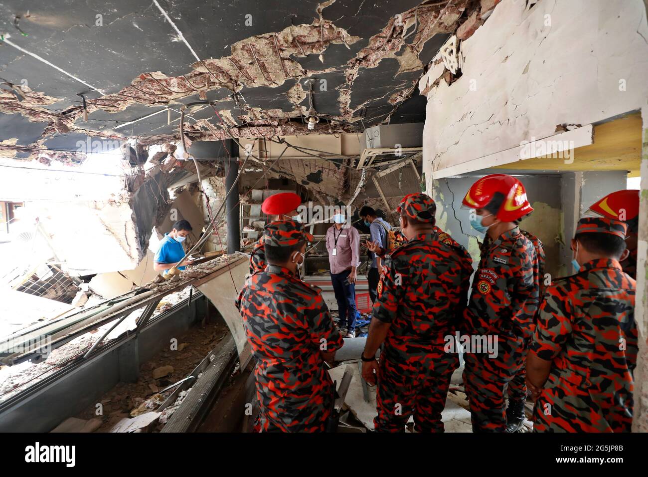 Dhaka, Bangladesh - June 28, 2021: Members of the rescue team work to ...