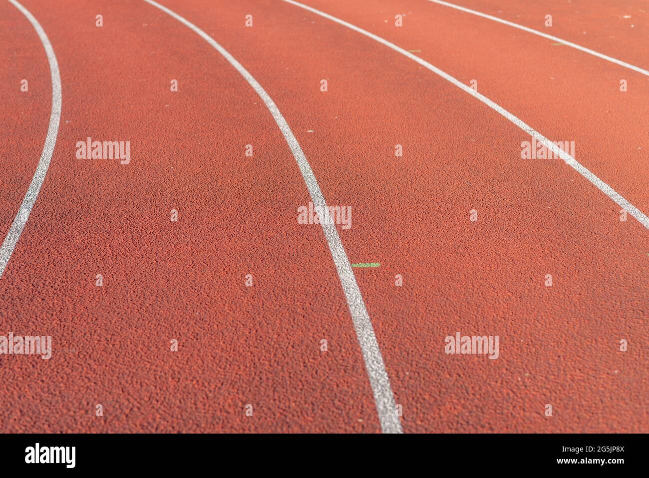 Part Red plastic track in the outdoor track and field stadium.Closeup ...