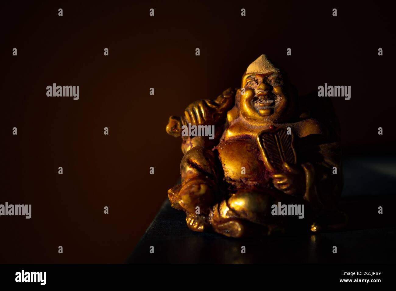 Laughing Buddha Statue on under the Tree. Statue of Laughing Buddha ...