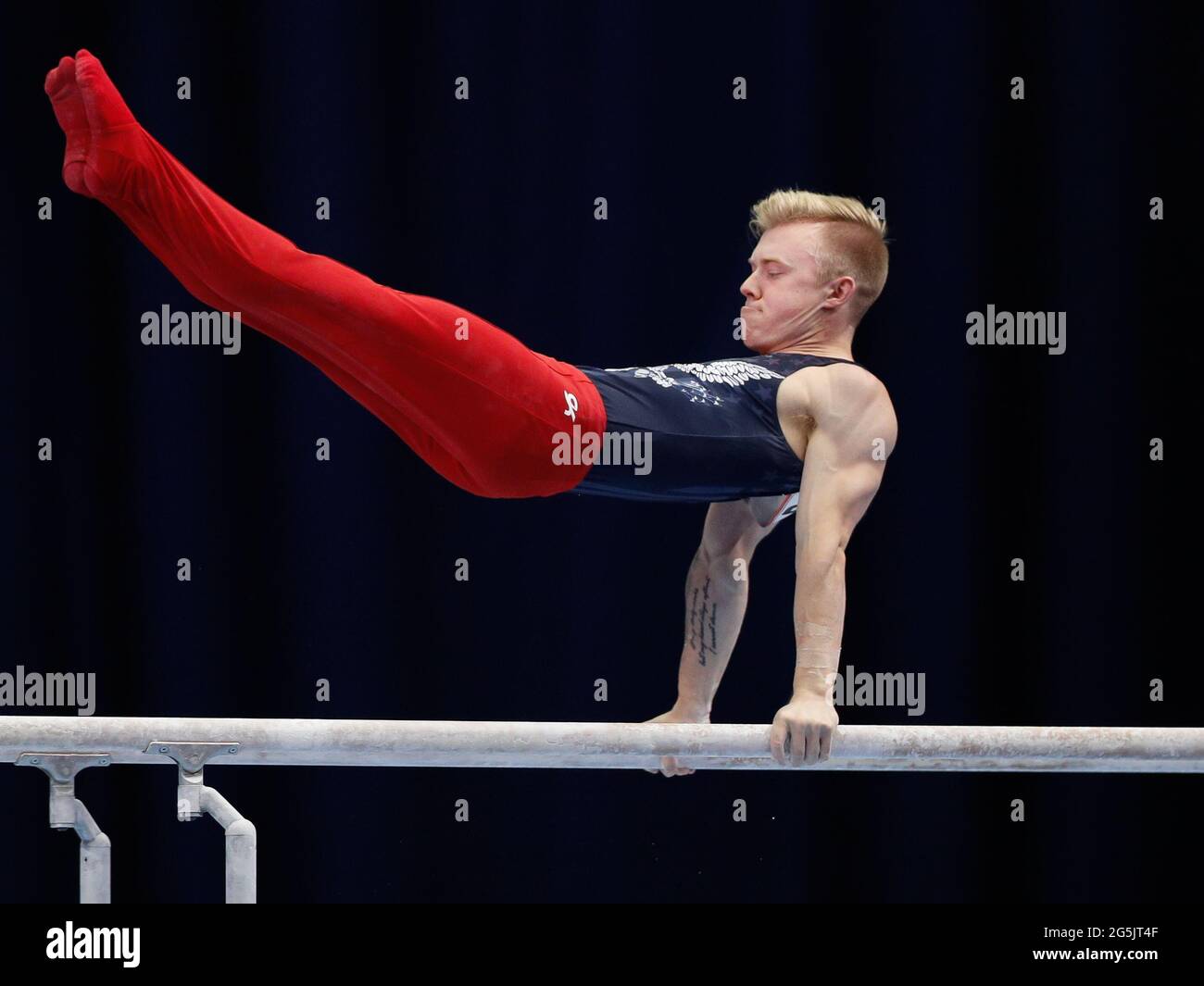 June 265, 2021: Cameron Bock performs on the parallel bars during Day 2 ...
