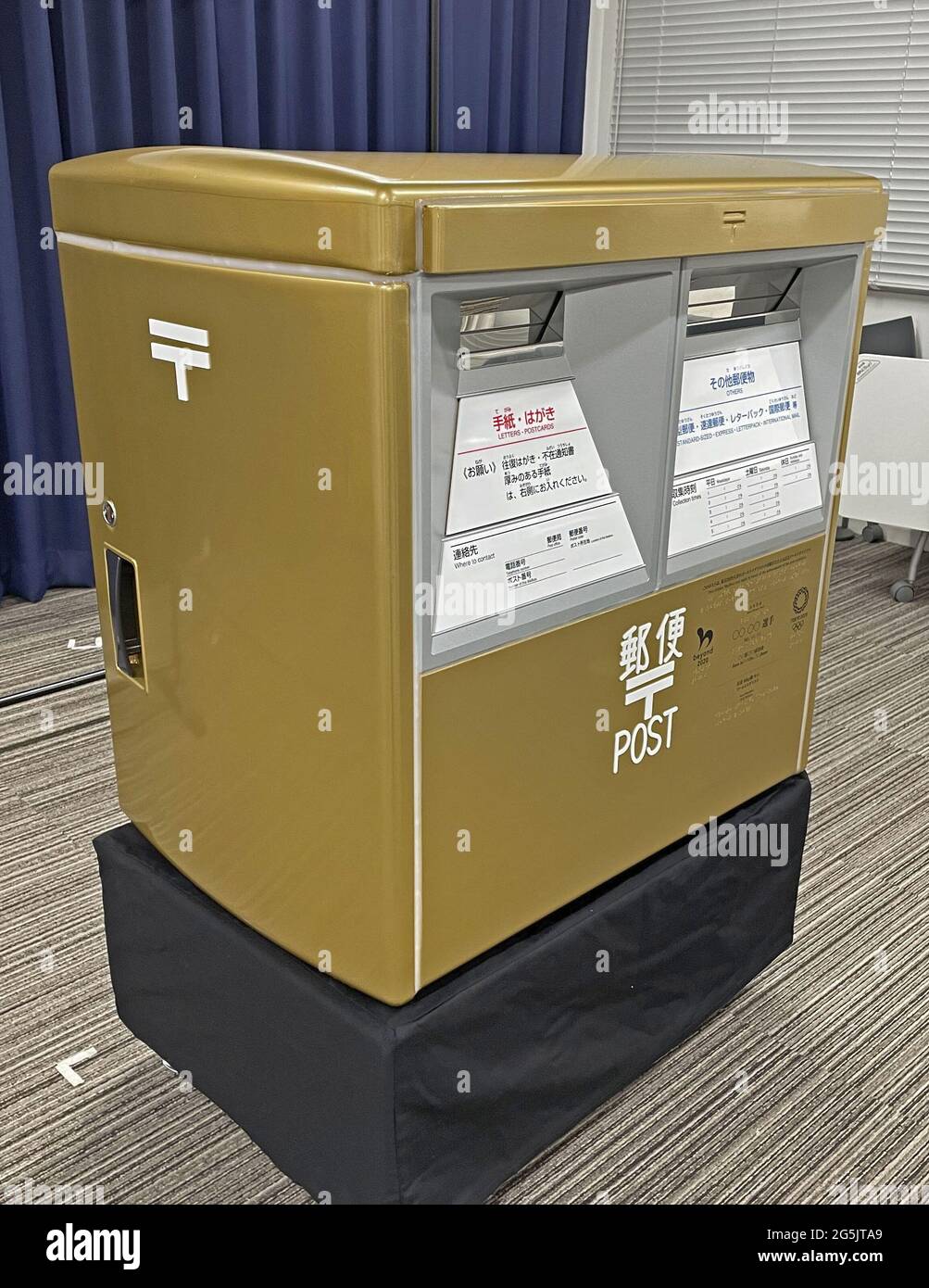 Photo taken in Tokyo on June 28, 2021, shows a golden mailbox. The ...