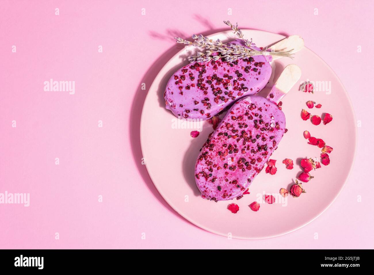 Lavender and rose petals ice cream, sweet chilled dessert. Trendy hard ...