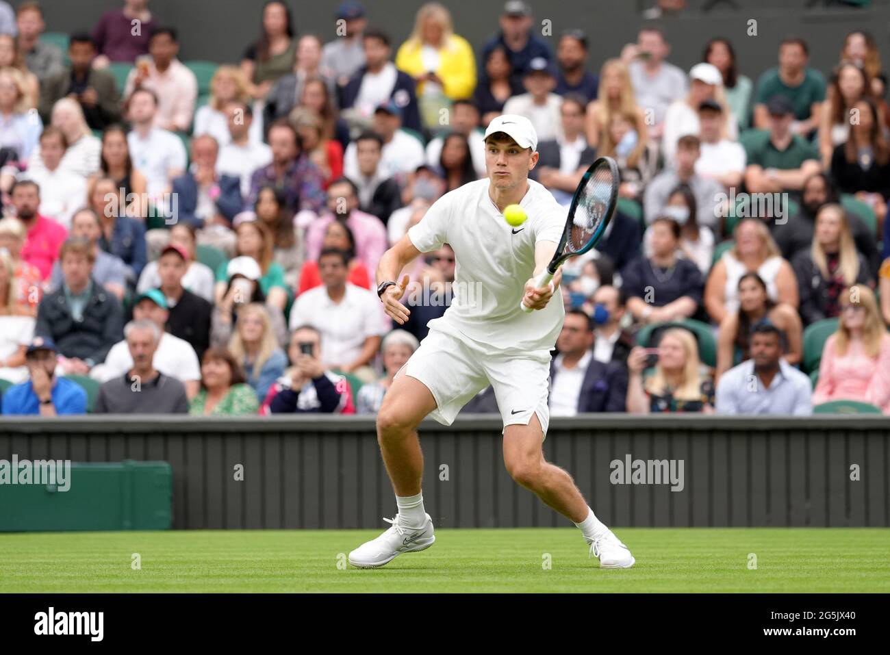 Jack Draper in action against Novak Djokovic on centre court on day one ...