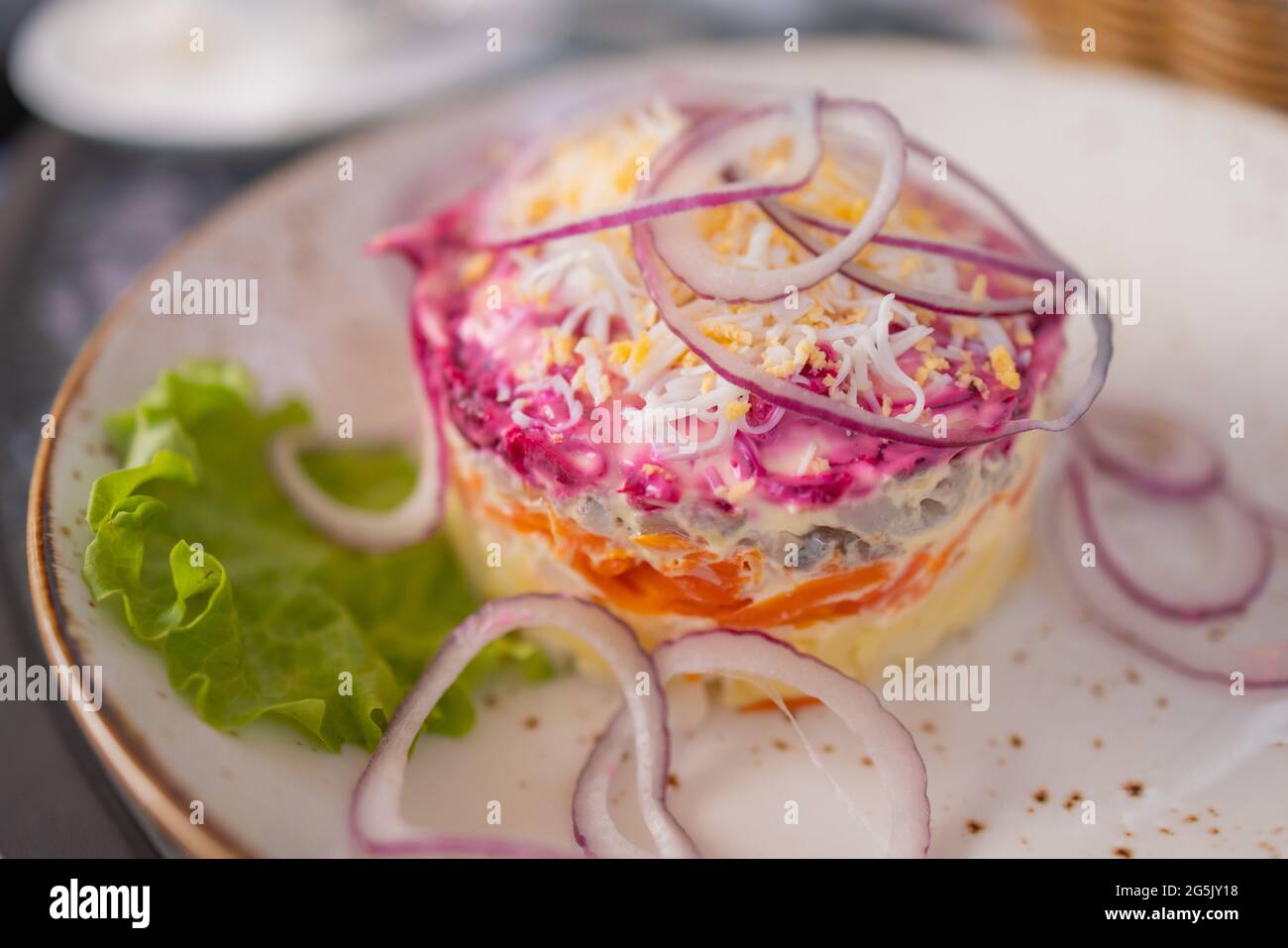 Homemade dressed pickled herring, traditional russian layered salad ...