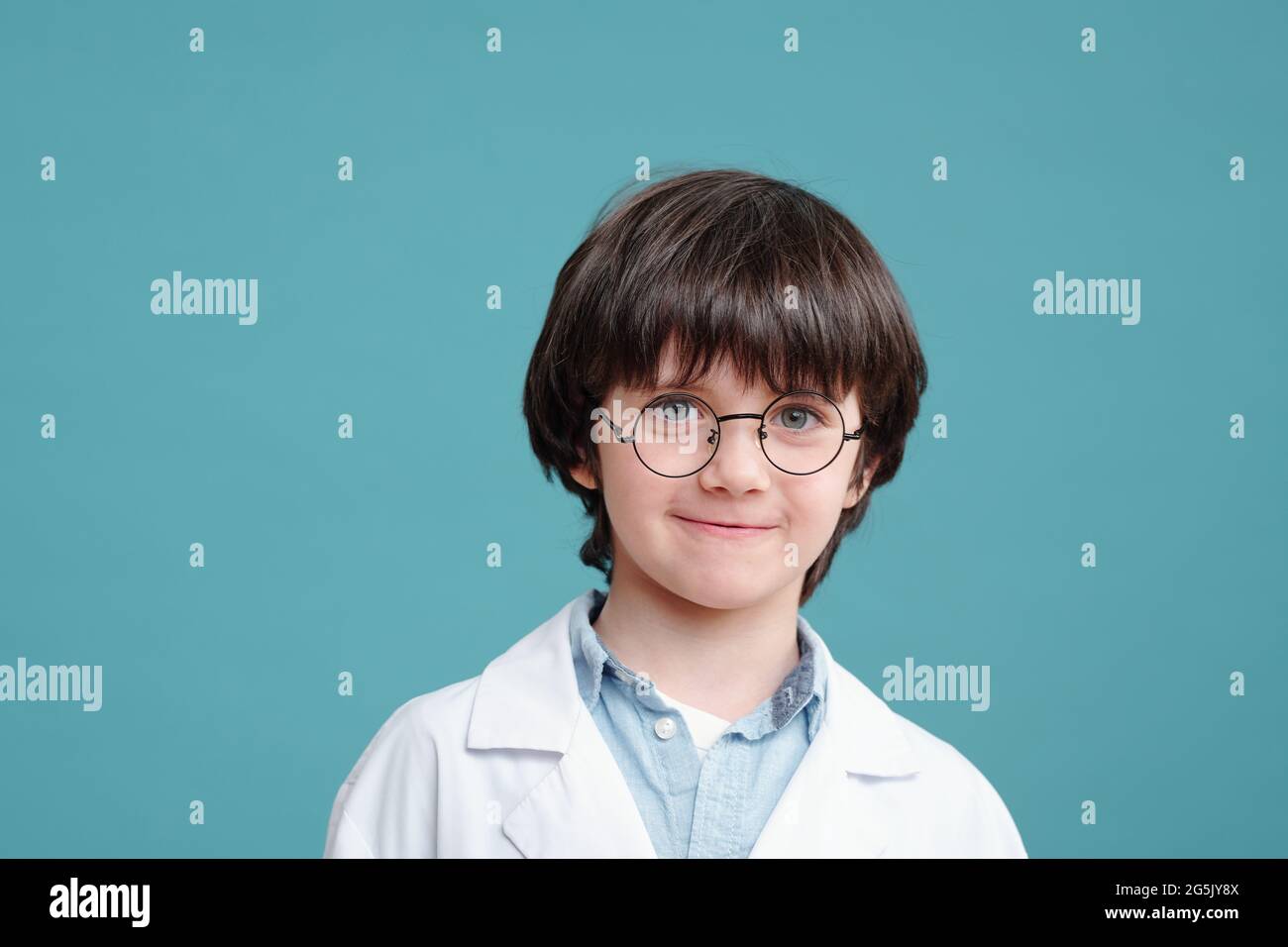 Adorable little boy in eyeglasses and whitecoat Stock Photo - Alamy