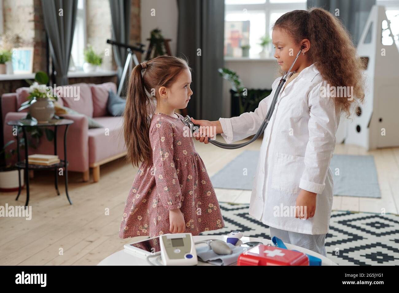 Kids playing doctor and patient hi-res stock photography and images - Alamy