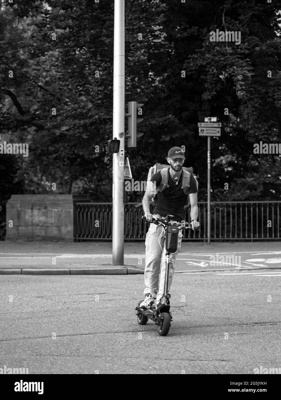 Deliveroo driver on scooter driving fast to deliver the internet Stock ...