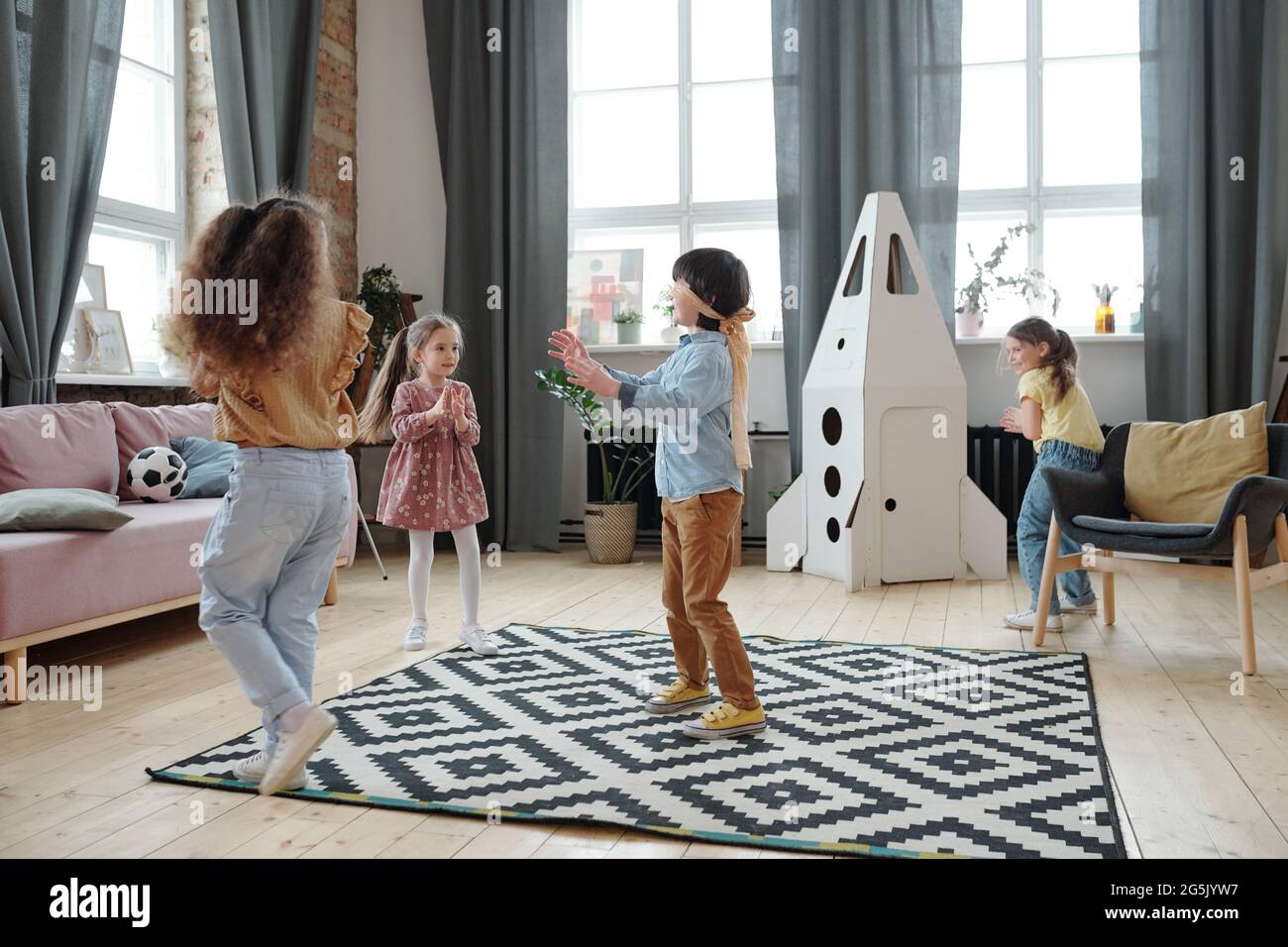 Group of children playing hi-res stock photography and images - Alamy