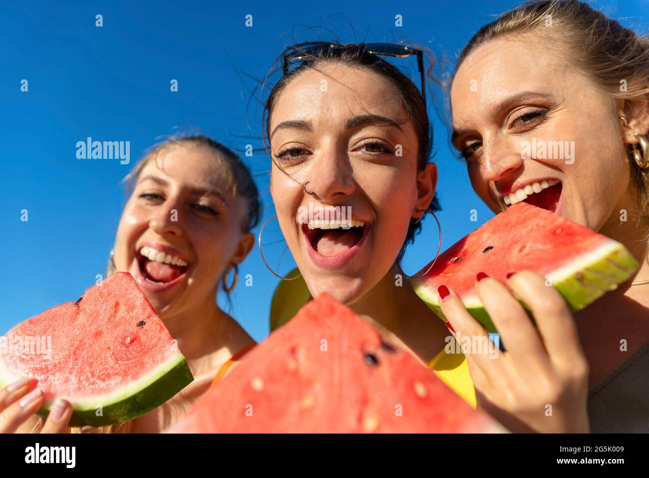 Close Up Pov Portrait Of Three Happy Girls Eating Watermelon At The