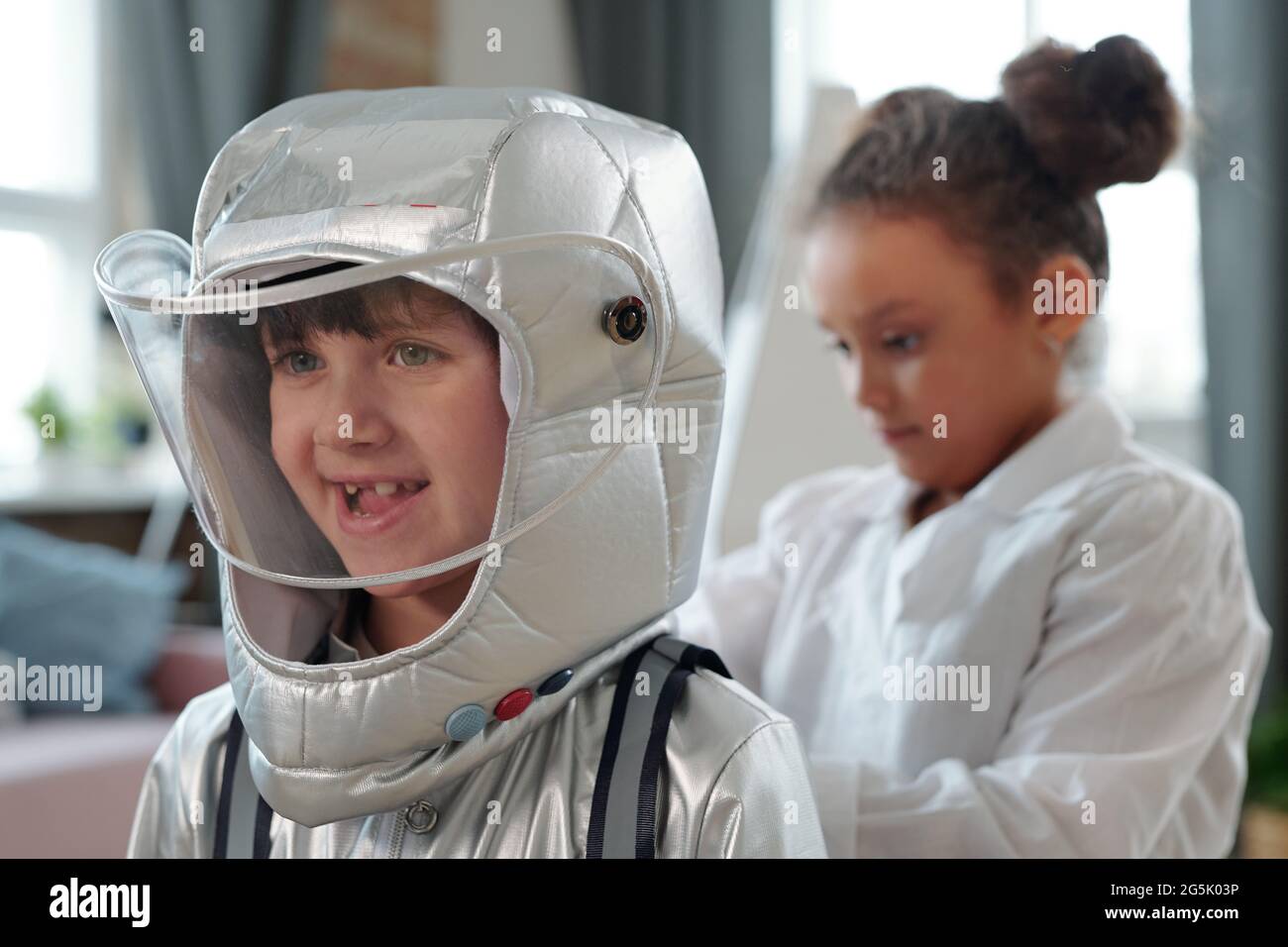 Little boy and girl wearing uniform of spaceman and doctor Stock Photo ...