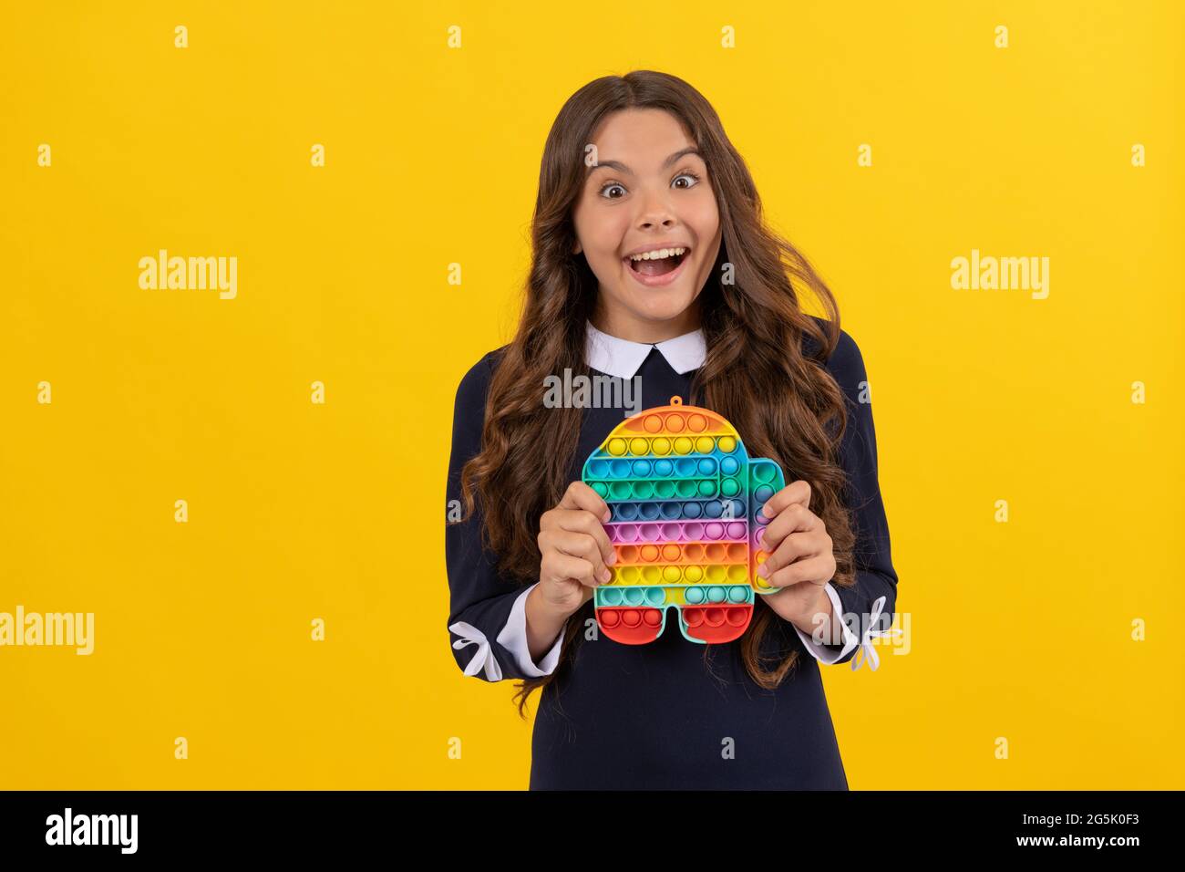 pop it fun. shocked child presenting color popit fidget. push button ...