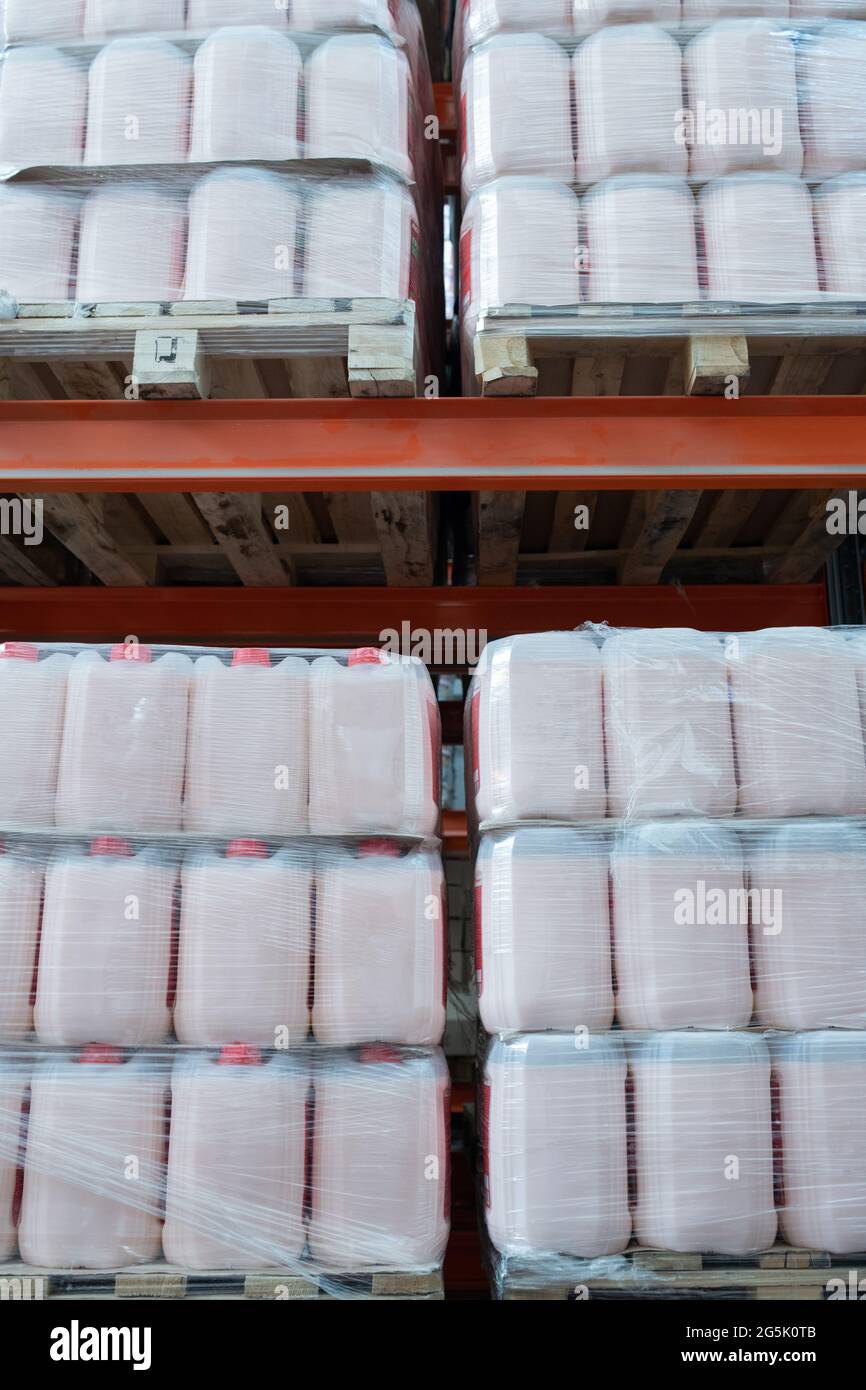 Shelves with packed canisters in large warehouse Stock Photo - Alamy