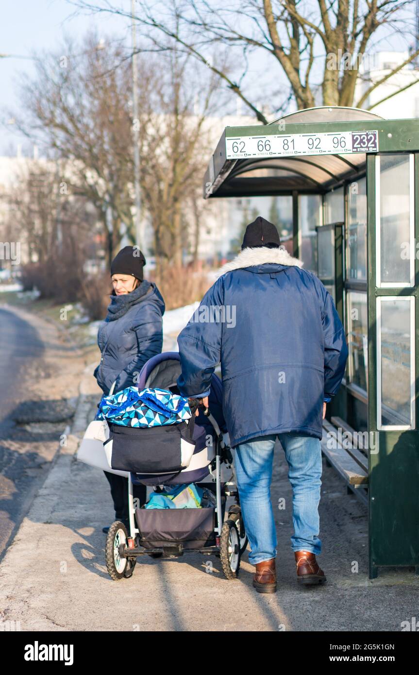 Woman waiting at bus stop with buggy hi-res stock photography and ...