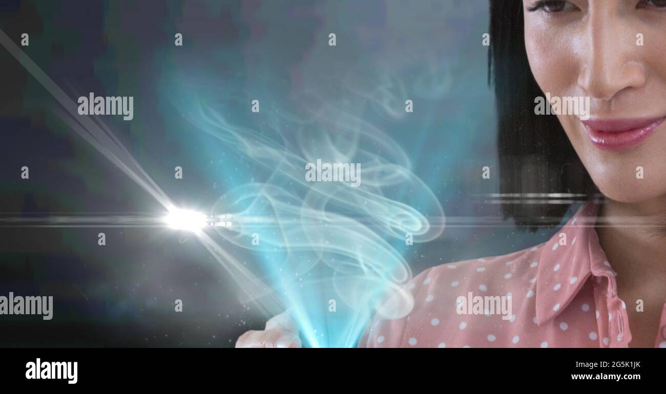 Composition of digital blue light trails over businesswoman Stock Photo ...