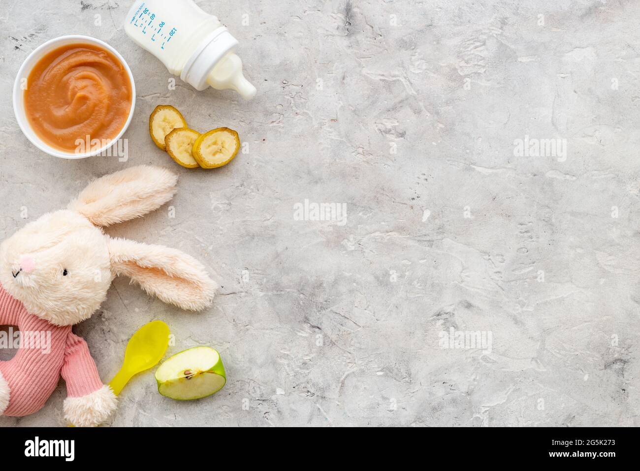 Fresh baby fruit food puree and milk bottle. Top view Stock Photo - Alamy