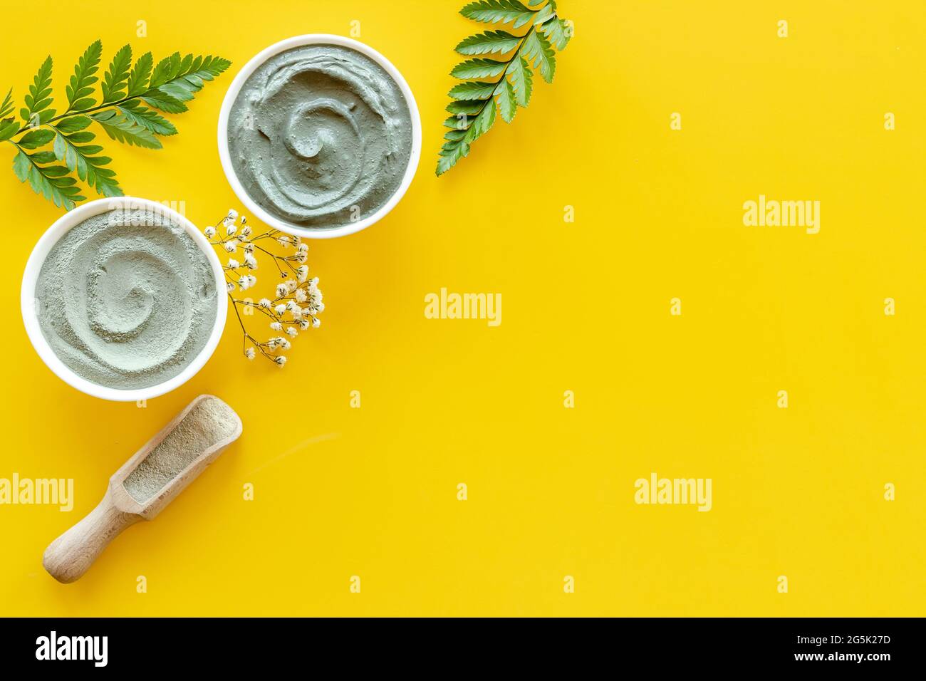 Blue clay cosmetic powder and mask in bowls. Top view Stock Photo - Alamy