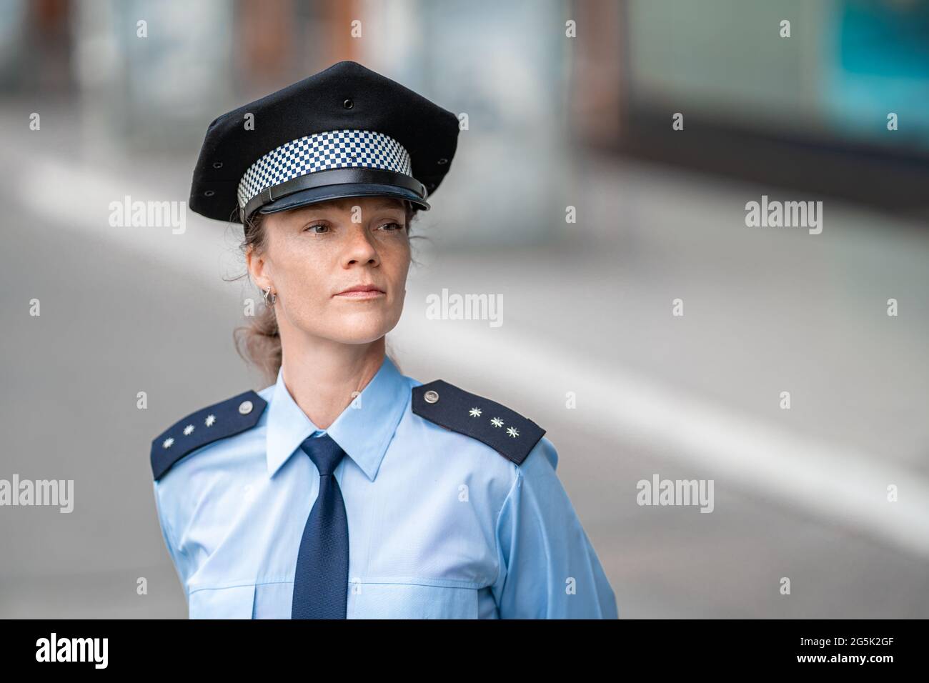 Police woman and badge hi-res stock photography and images - Alamy