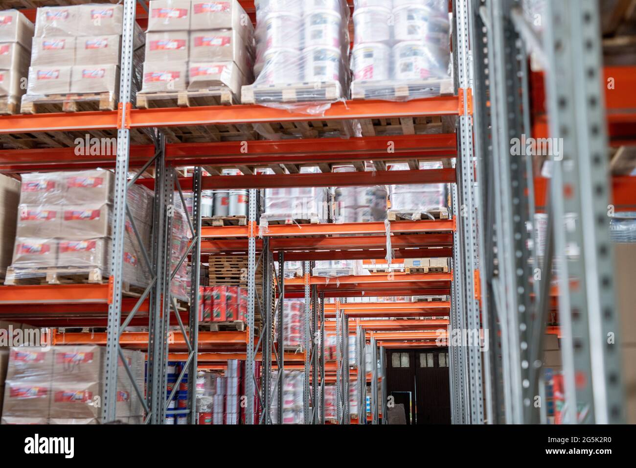 Racks with packed goods in warehouse of modern hypermarket Stock Photo ...