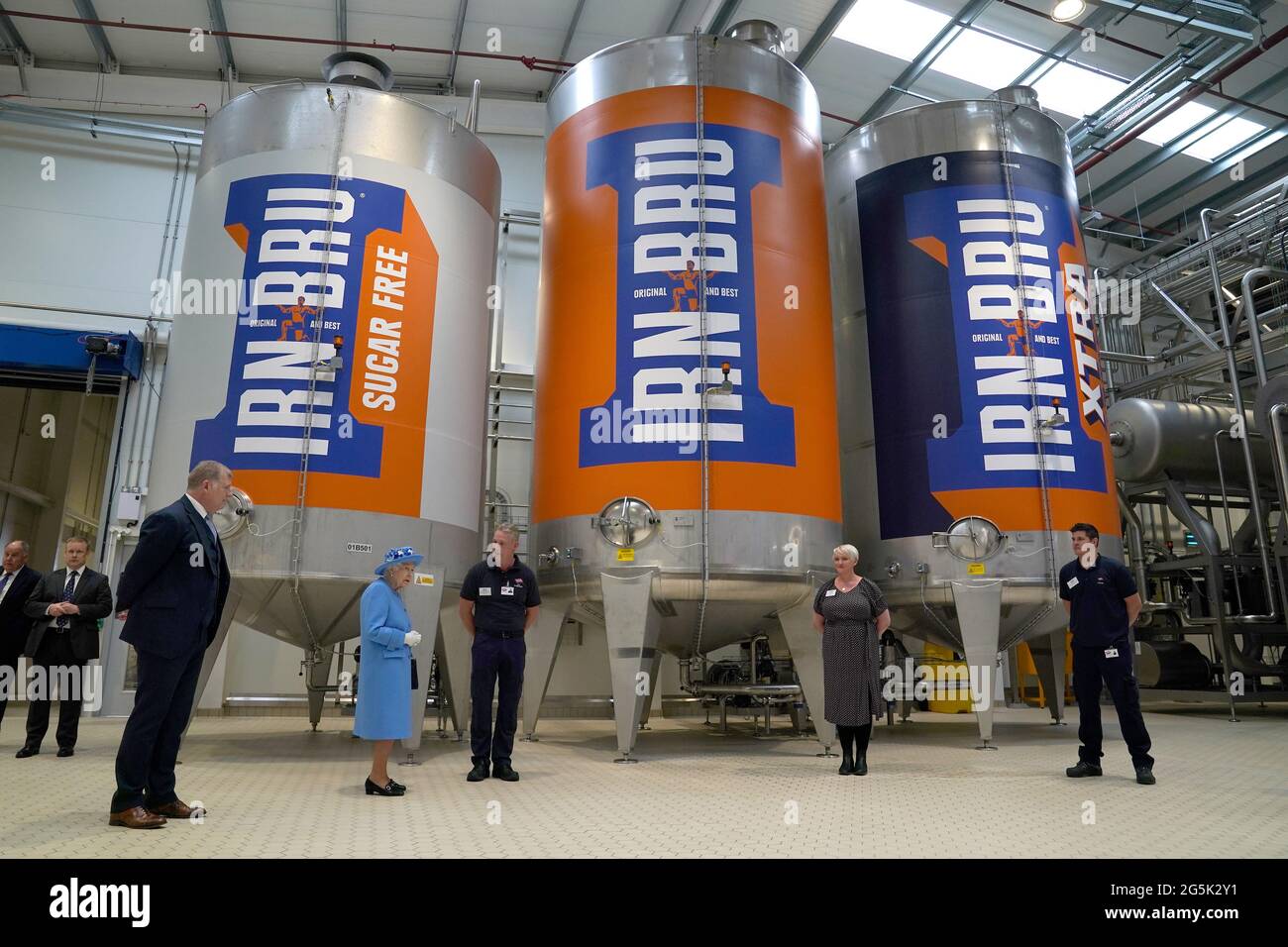Queen Elizabeth II is shown a tour of the factory during a visit to AG ...