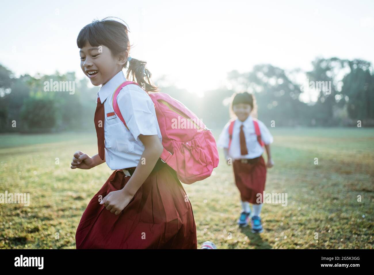 little girl student running together while going to their school Stock ...