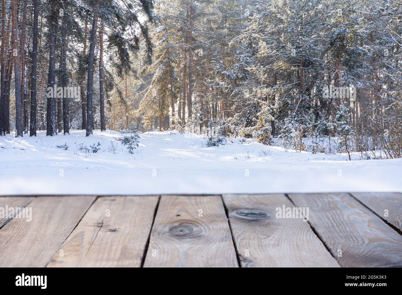 Beautiful winter scene. blurred background of snowy christmas nature background, Wood table top ...