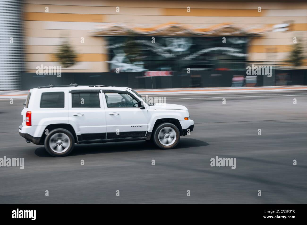 Ukraine, Kyiv - 27 June 2021: White Jeep Patriot car moving on the ...