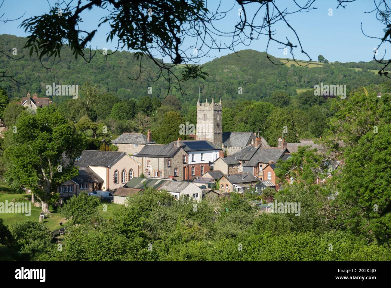 View over Dartmoor village of Lustleigh with the church and cottages ...