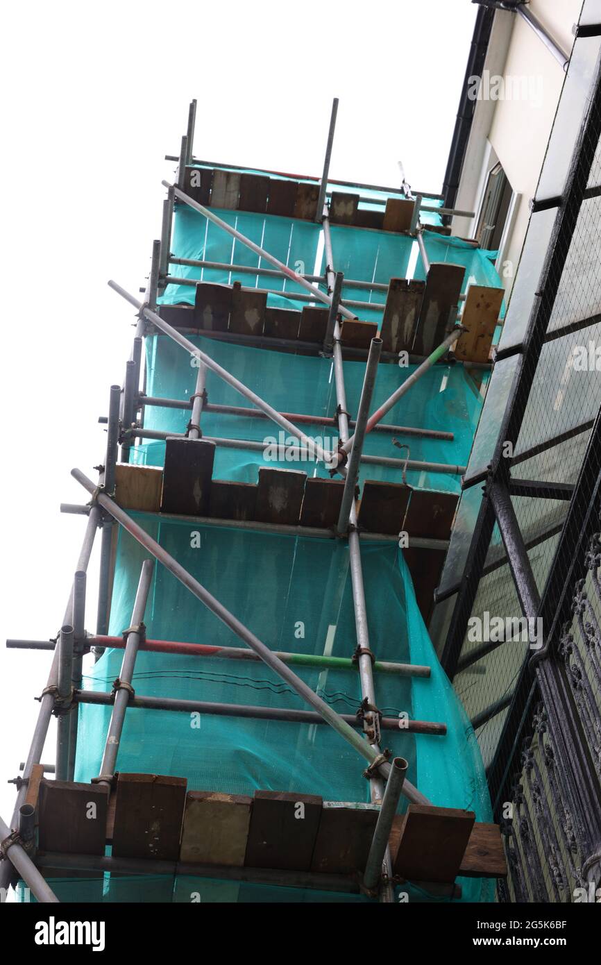 Scaffolding seen against a building in the UK Stock Photo - Alamy