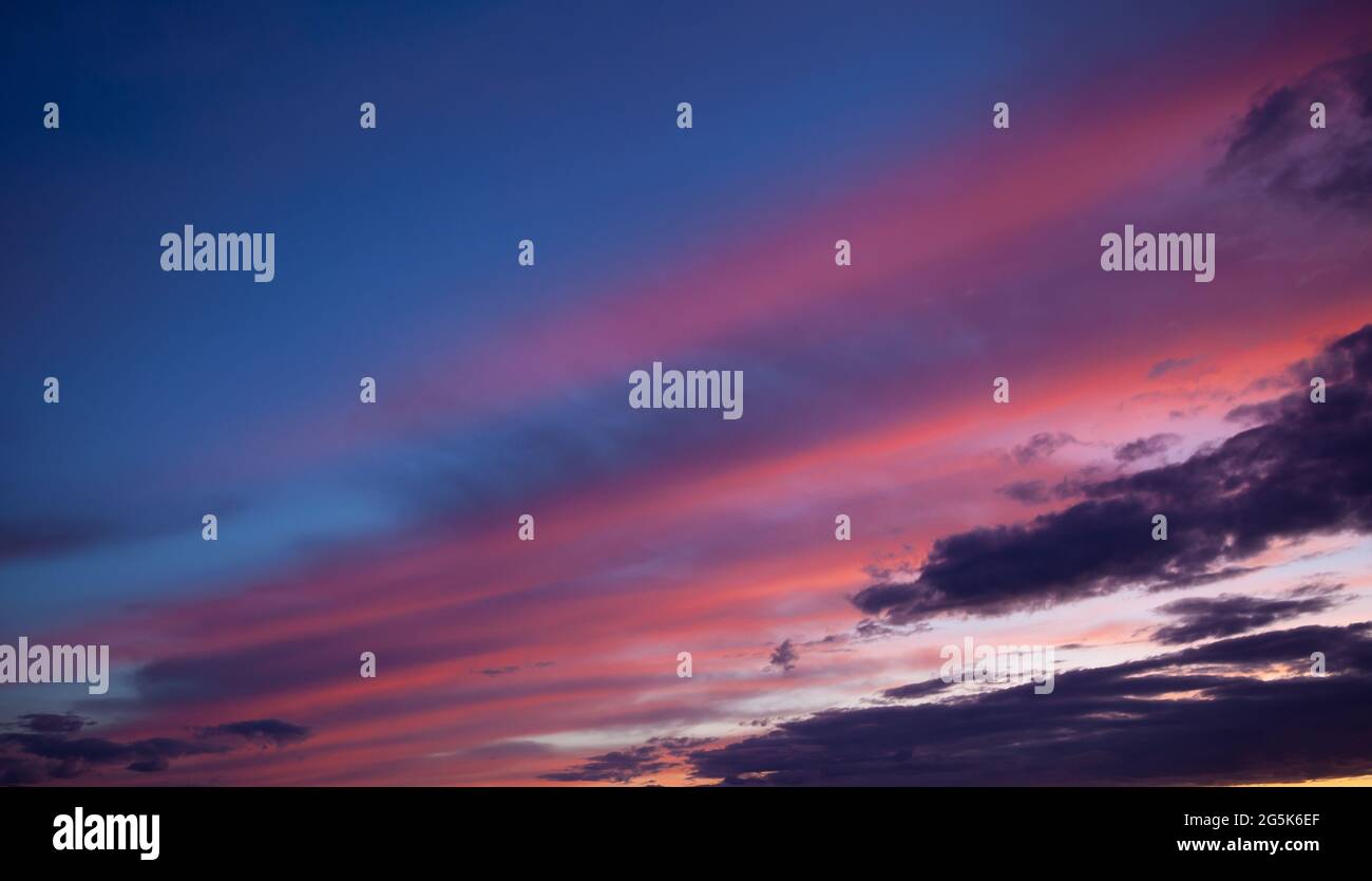 Multi-colored clouds on the dramatic sky. Consumption and sunset clouds ...