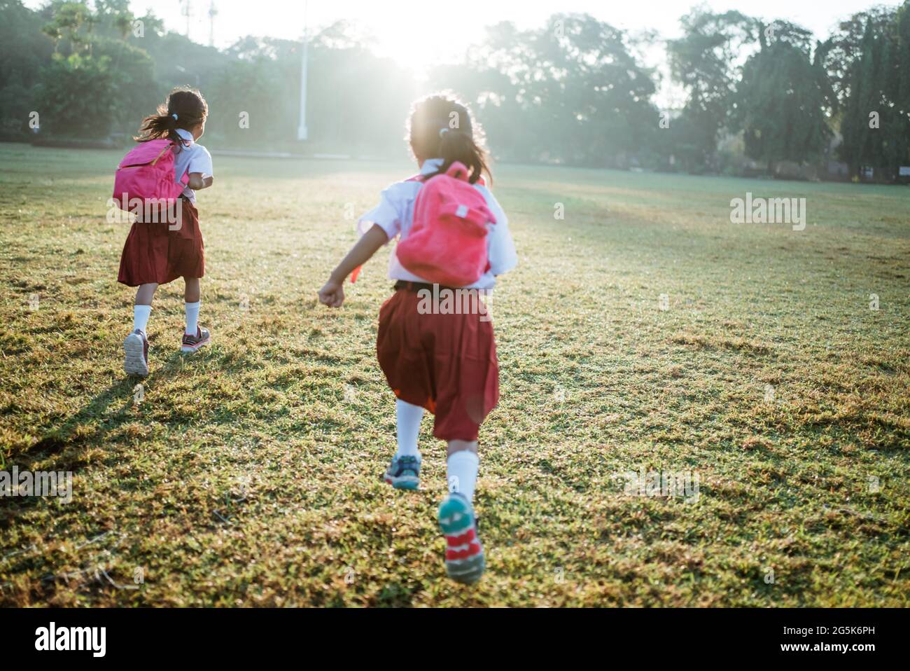 little girl student running together while going to their school Stock ...