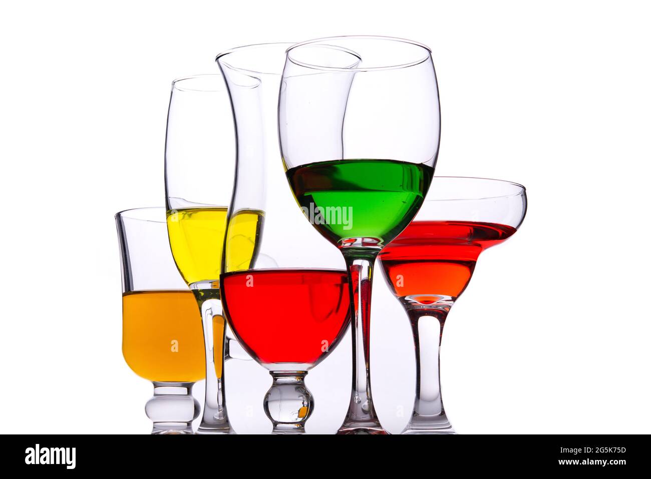 Different types of crystal glasses with colorful liquid inside Stock ...