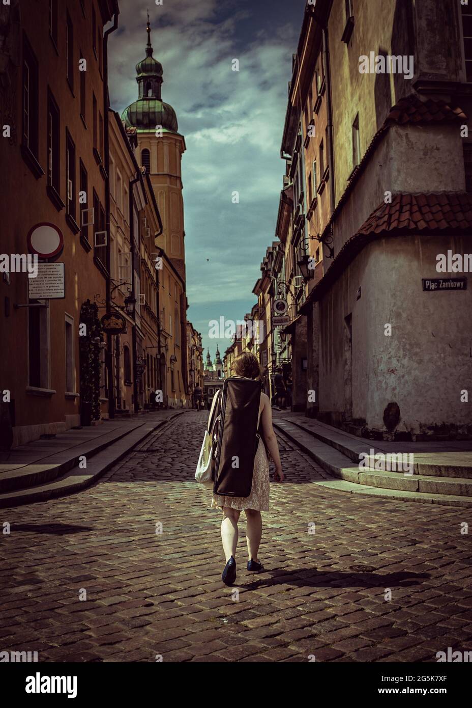 girl with violin, Warsaw old town, violin in backpack Stock Photo - Alamy