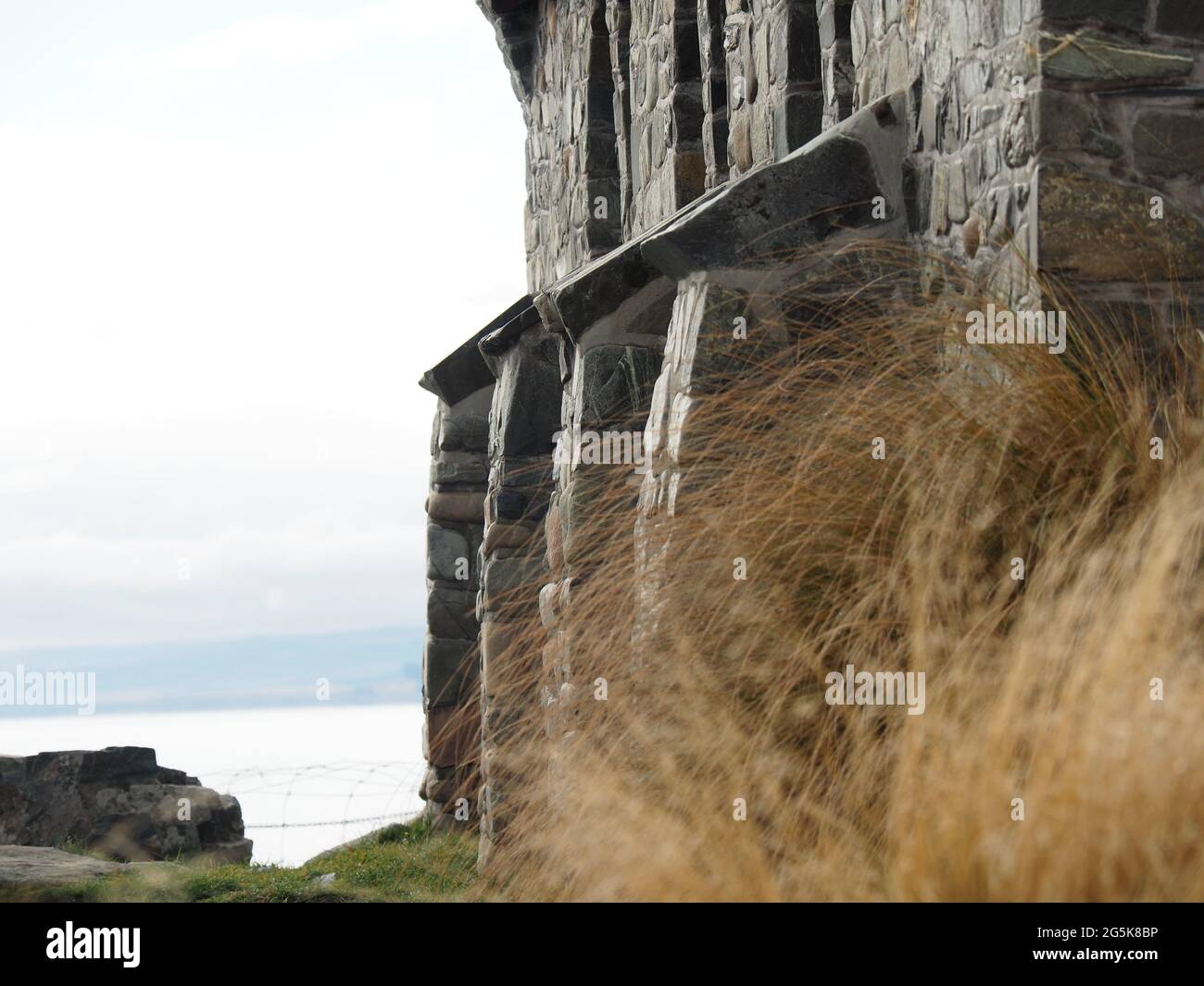 Facade of an ancient stone building at the beach Stock Photo - Alamy