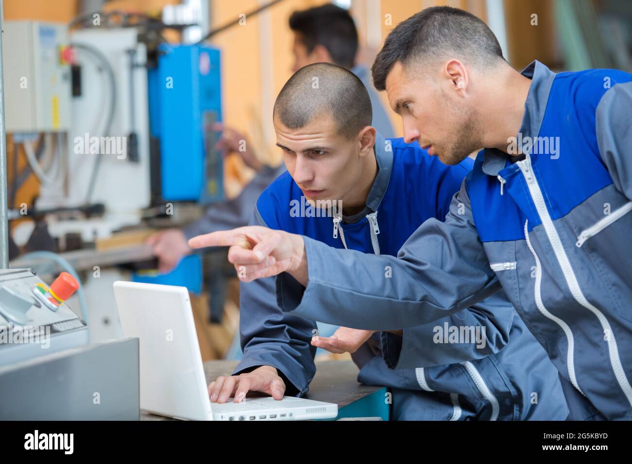 technicians using computer in a factory Stock Photo - Alamy