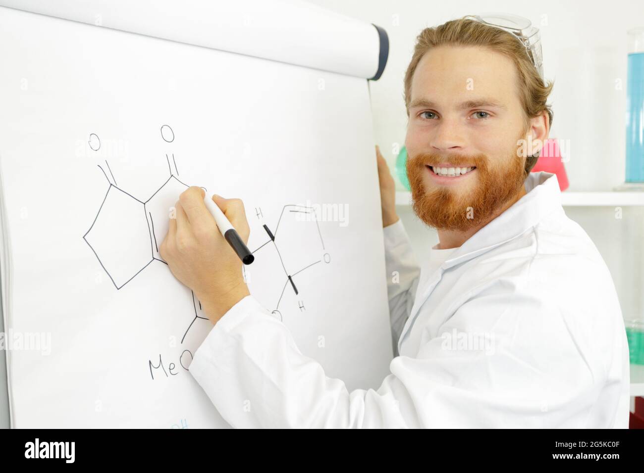 chemist stands with written formulas Stock Photo - Alamy