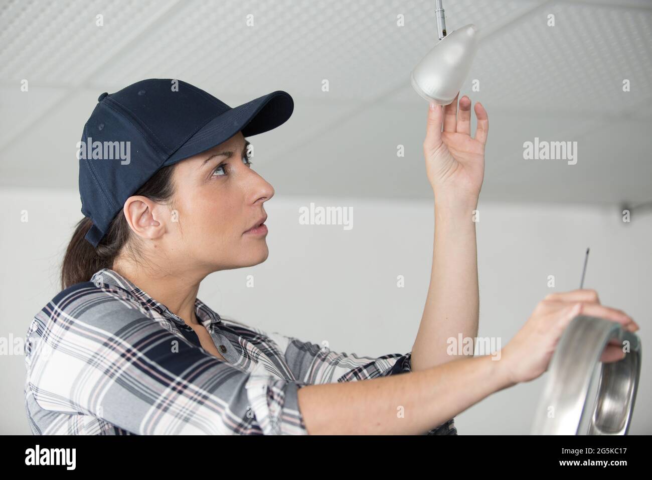 Female electrician fixing wire hi-res stock photography and images - Alamy