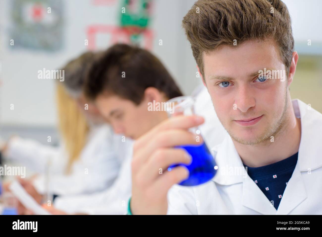 young man showing his experiment Stock Photo - Alamy